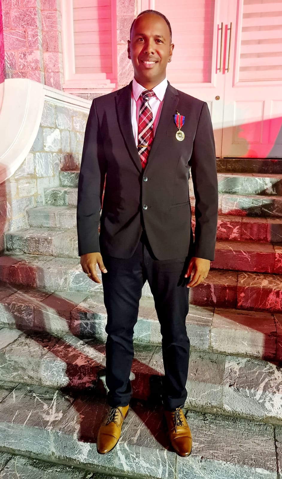 CWI President Dr Kishore Shallow congratulates Vice President Azim ...