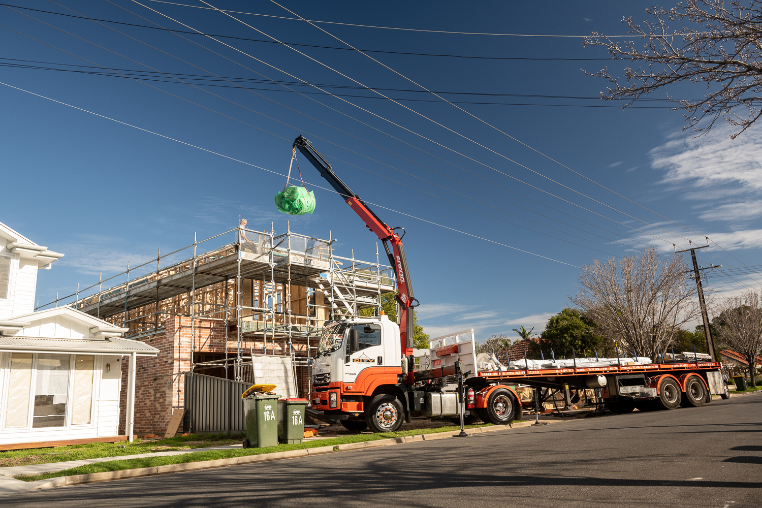 Building up Adelaide: City Crane Trucks & Isuzu Climb to the Top